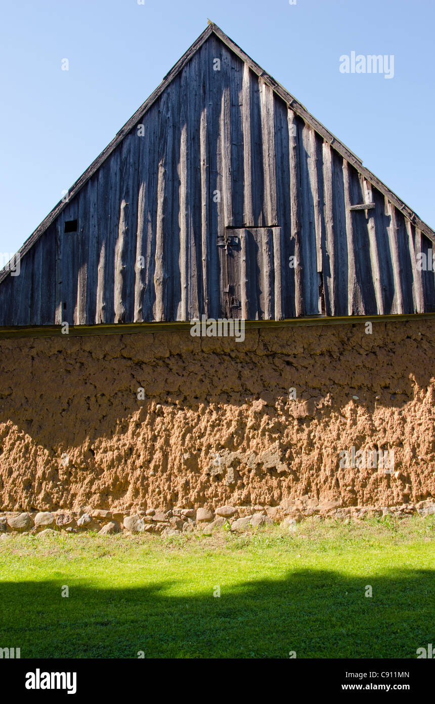 Ancient house with mole walls and wooden roof. Retro architectural ...