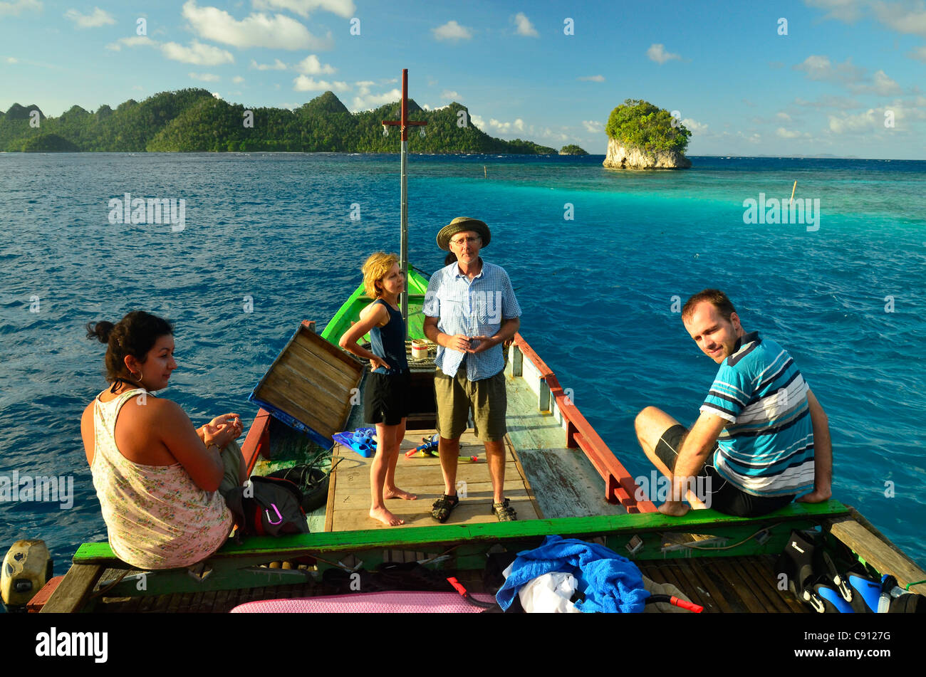 Tourists on boat in stunning Wayag Islands, Raja Ampat islands near ...
