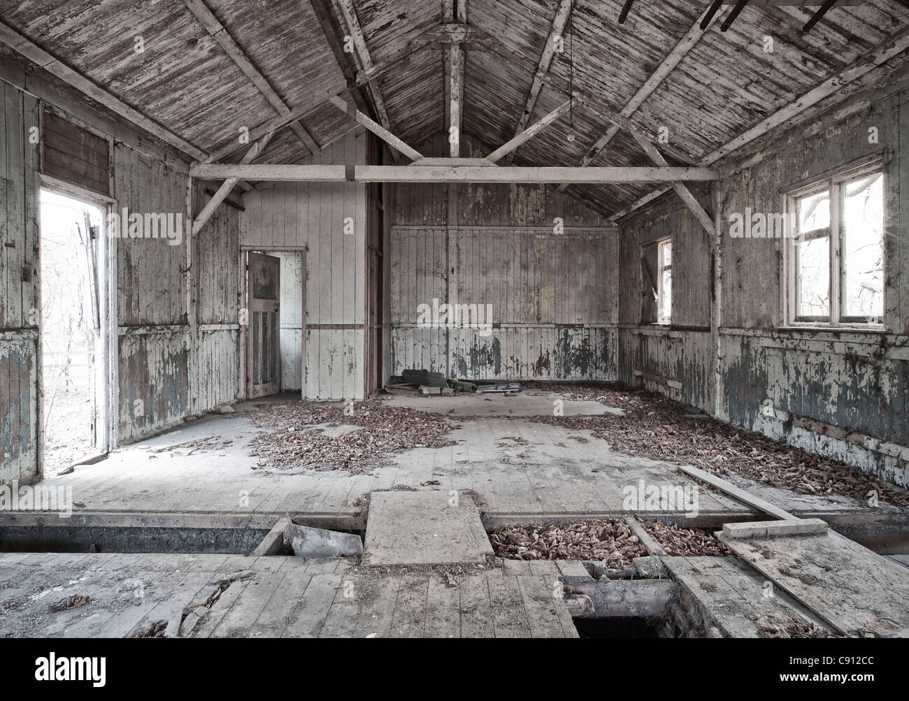 Empty spaces run down broken wooden building derelict Stock Photo - Alamy