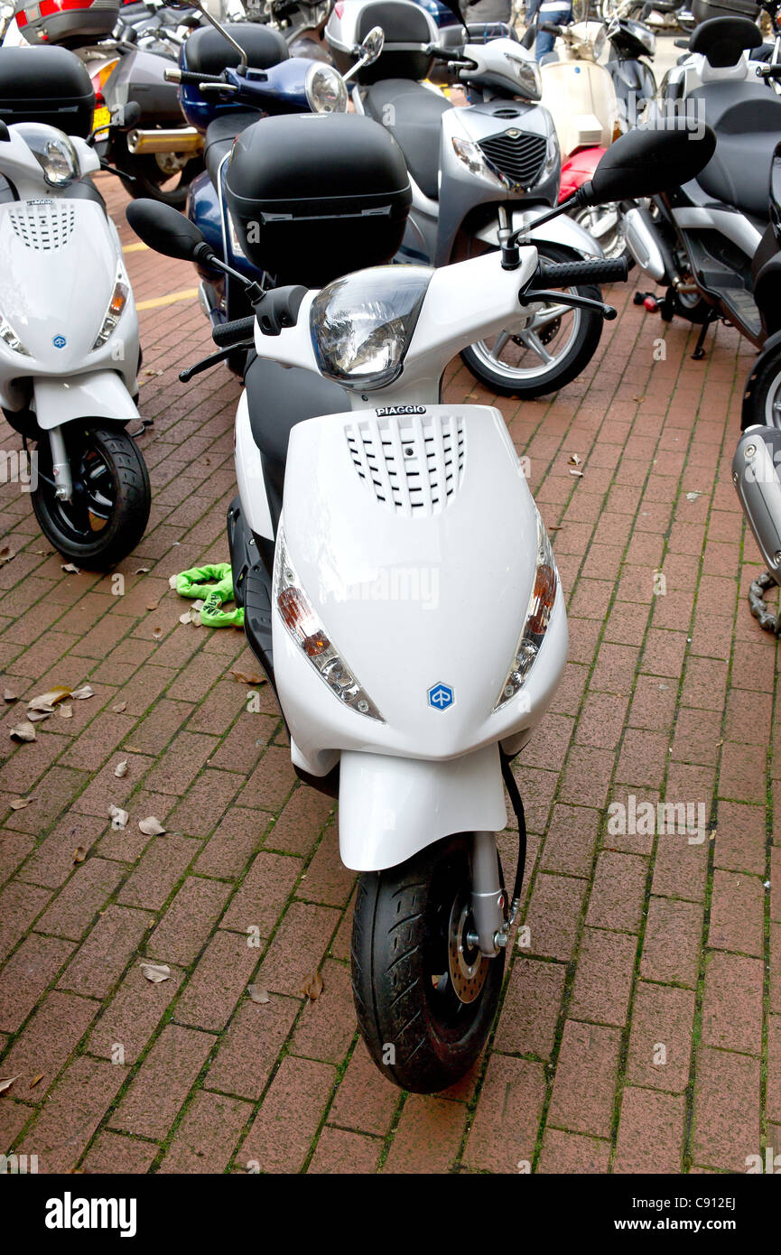 Scooters parked on a street Stock Photo - Alamy