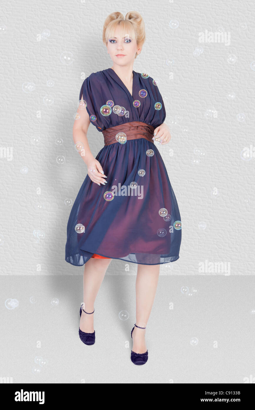 Beautifully dressed model between many soap bubbles Stock Photo - Alamy