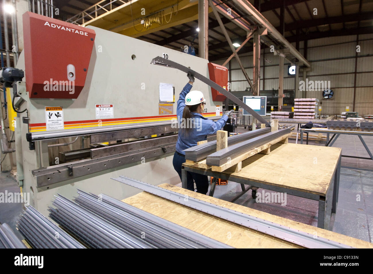 Hispanic female working at steel processing facility in Houston, Texas ...