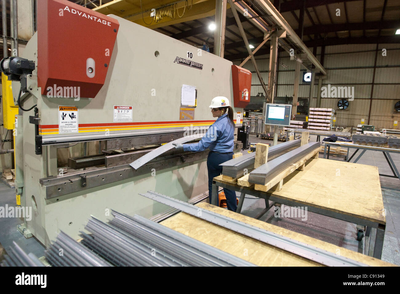 Hispanic female working at steel processing facility in Houston, Texas ...