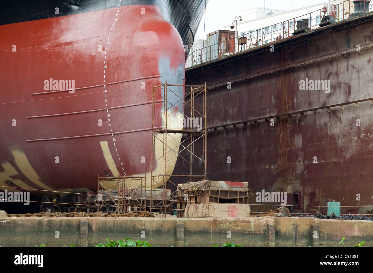Bulb of ship being maintained in a floating dock Stock Photo - Alamy