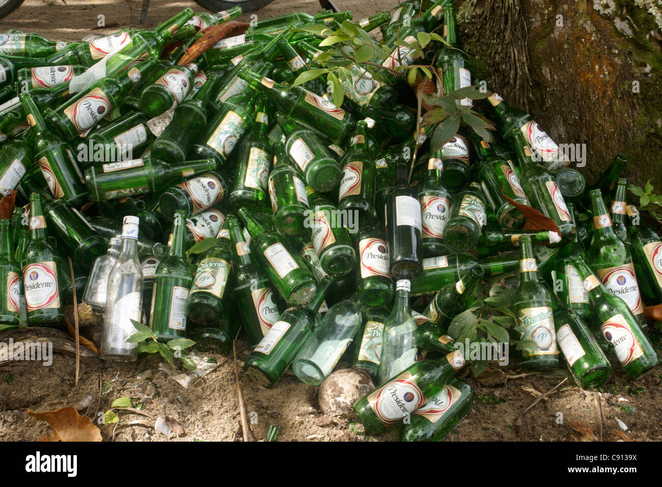 Beer bottles are collected for recycling in the Caribbean and there is ...