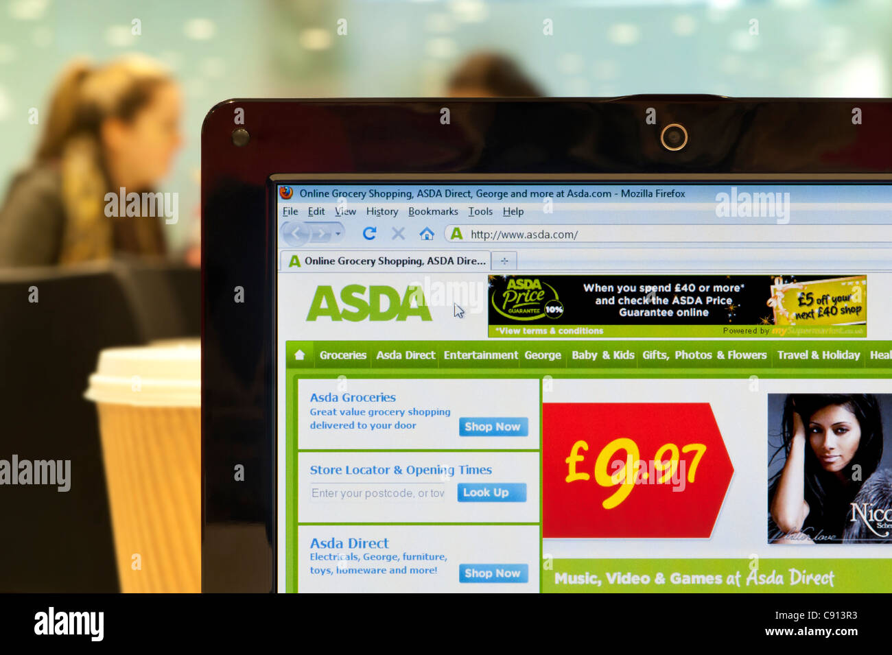 The Asda website shot in a coffee shop environment (Editorial use only ...