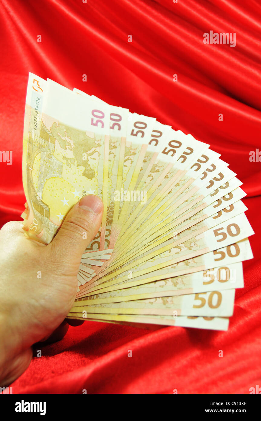 Handing money euros hi-res stock photography and images - Alamy