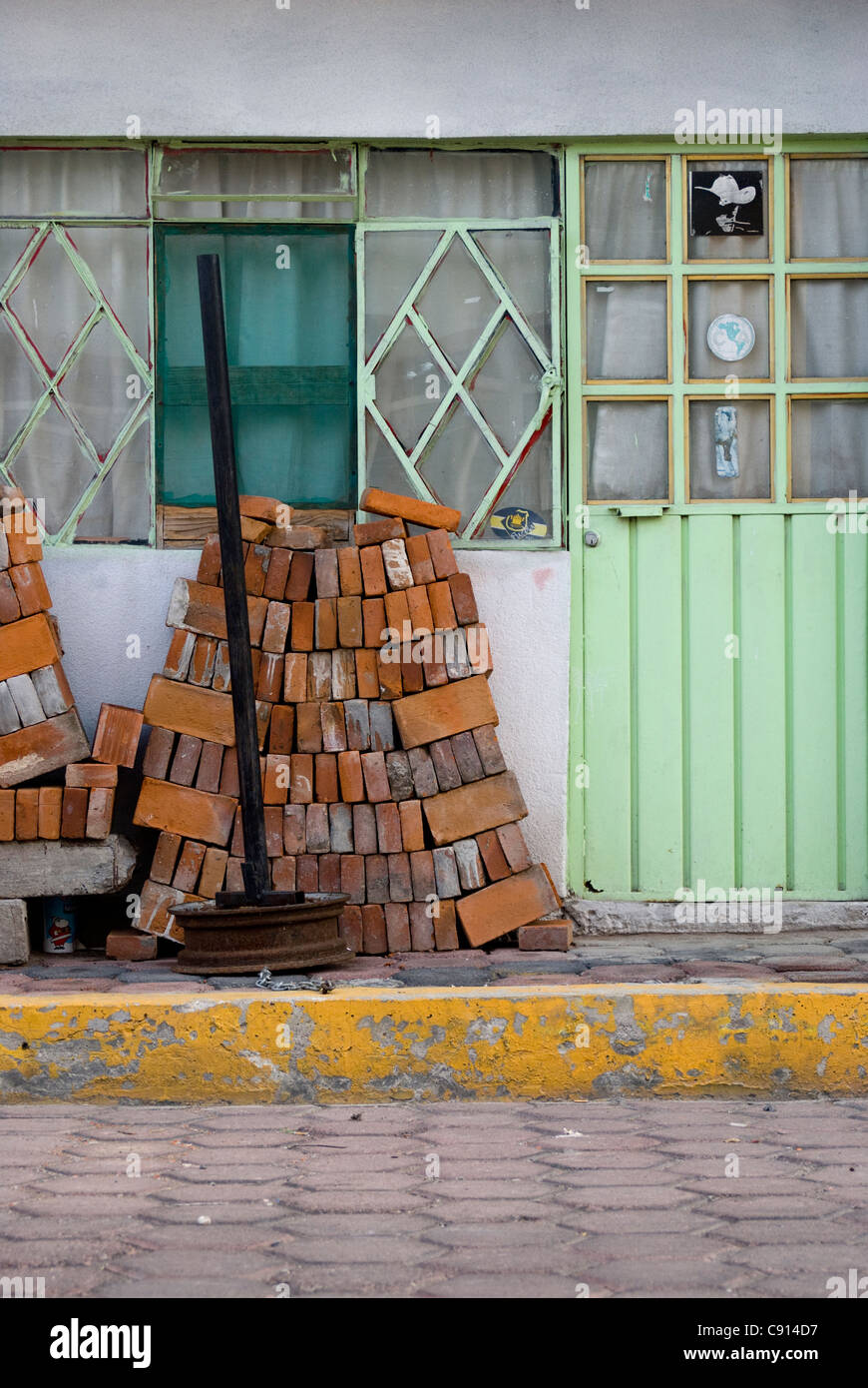 Bricks piled up in front of a house in Cholula, Mexico Stock Photo - Alamy