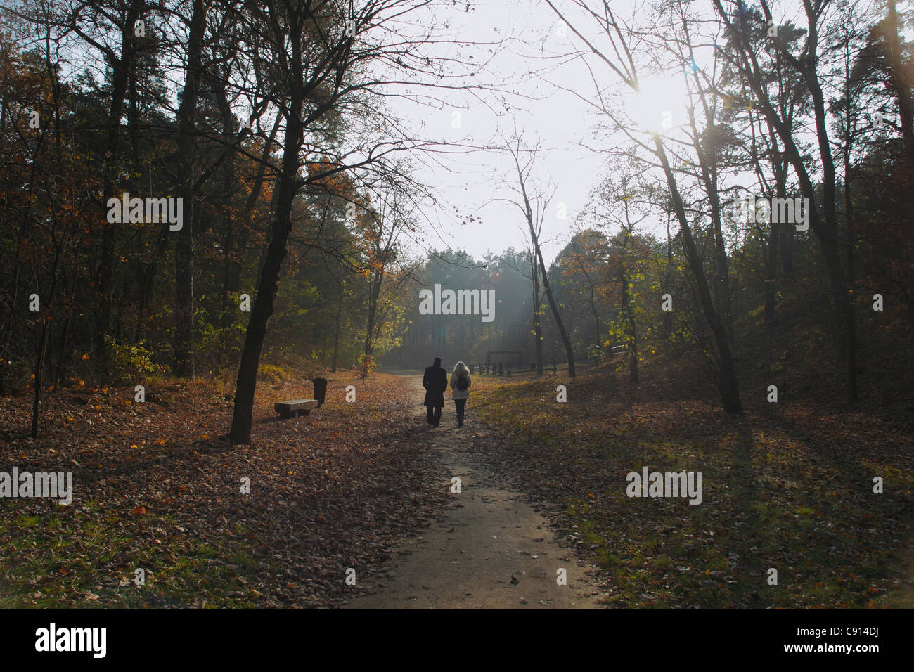 Middle aged couple taking a romantic walk during warm and sunny day in ...