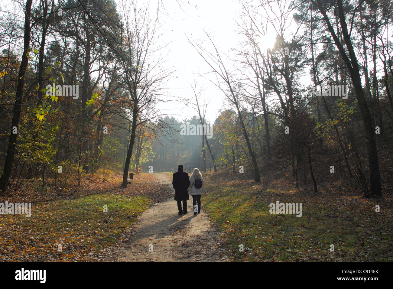 Middle aged couple taking a romantic walk during warm and sunny day in ...