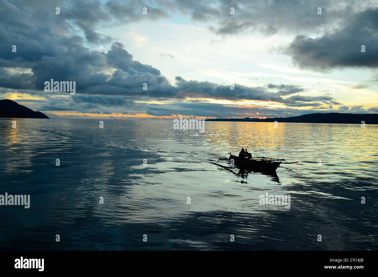 Boat on calm Pacific Ocean, Raja Ampat islands of Western Papua in the ...