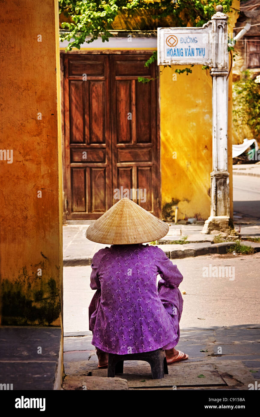 Vietnamese woman sitting in Hoi An Vietnam Stock Photo - Alamy