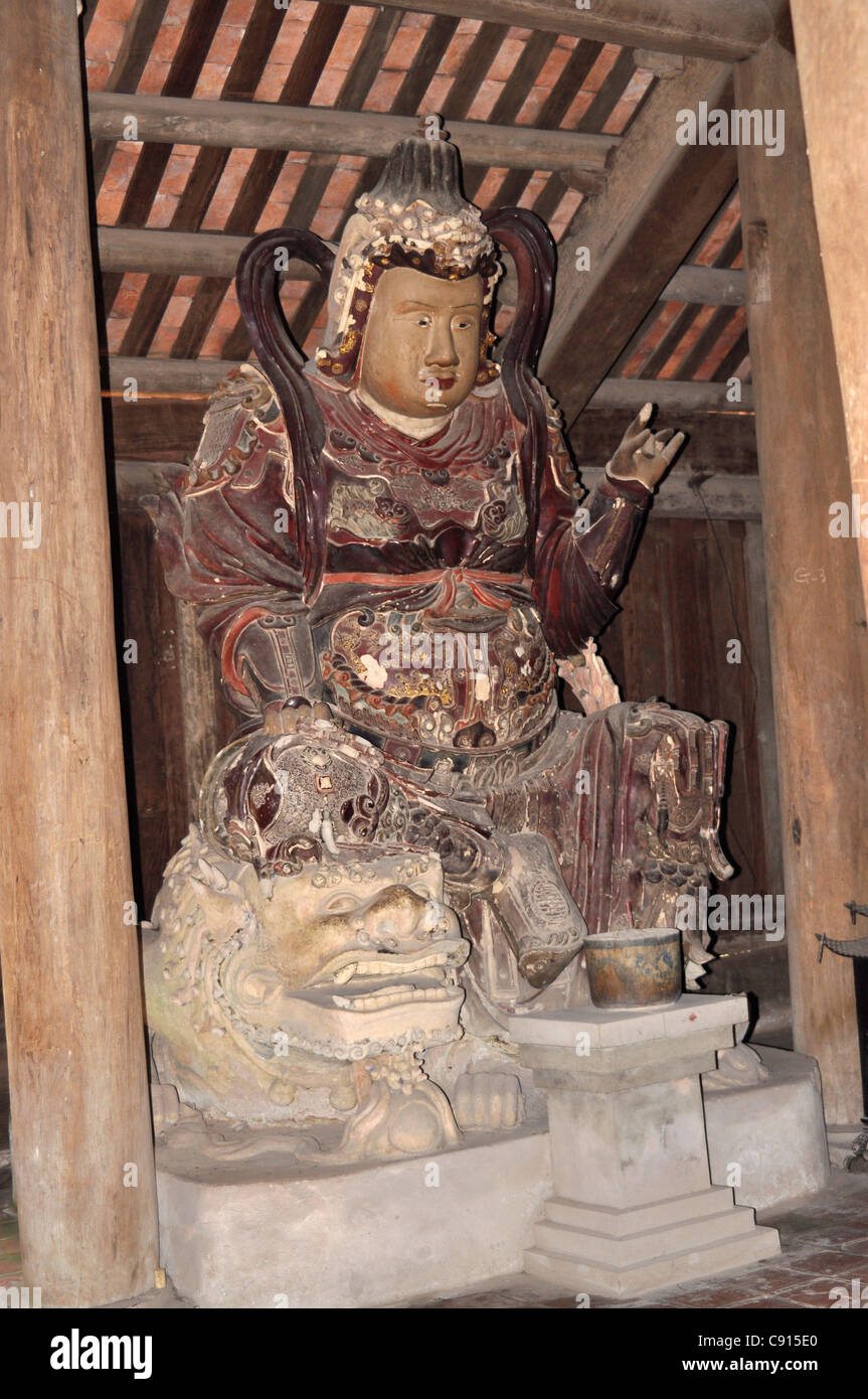 Traditional temples in Vietnam are adorned with deities statues and ...