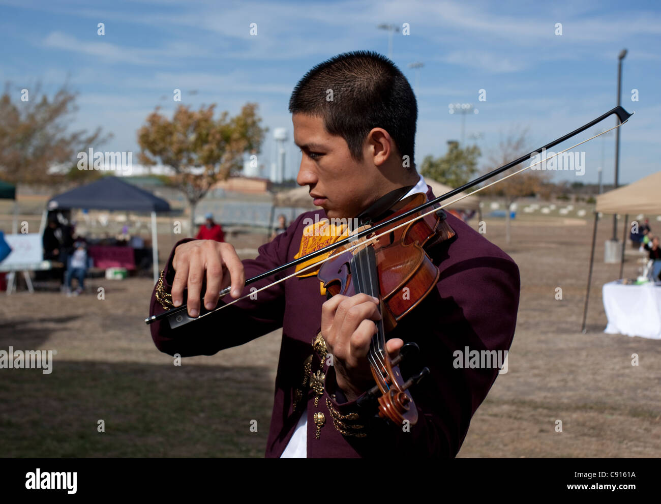 College students are members of Mariachi musical group and play during ...