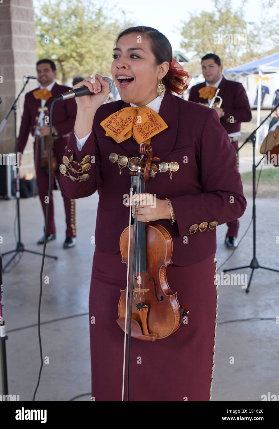 College students are members of Mariachi musical group and play during ...