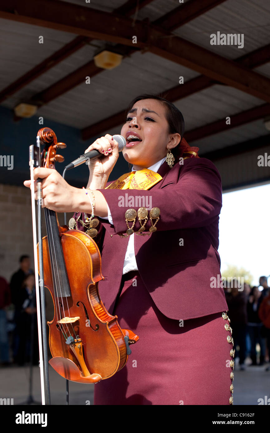 College students are members of Mariachi musical group and play during ...