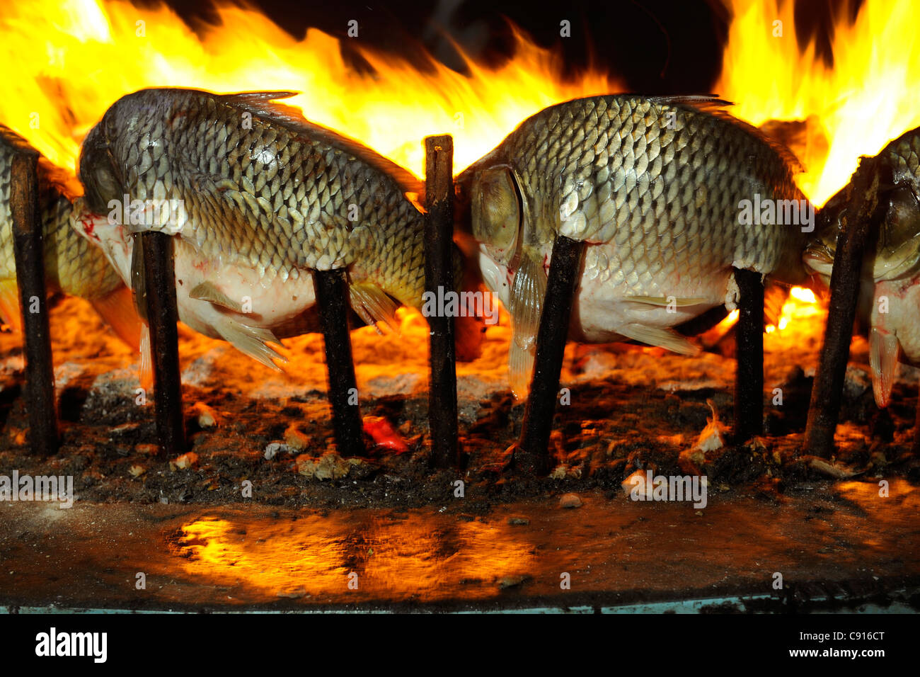 Iraq, Baghdad, Masgouf a Baghdadi fish speciality served in a row of ...