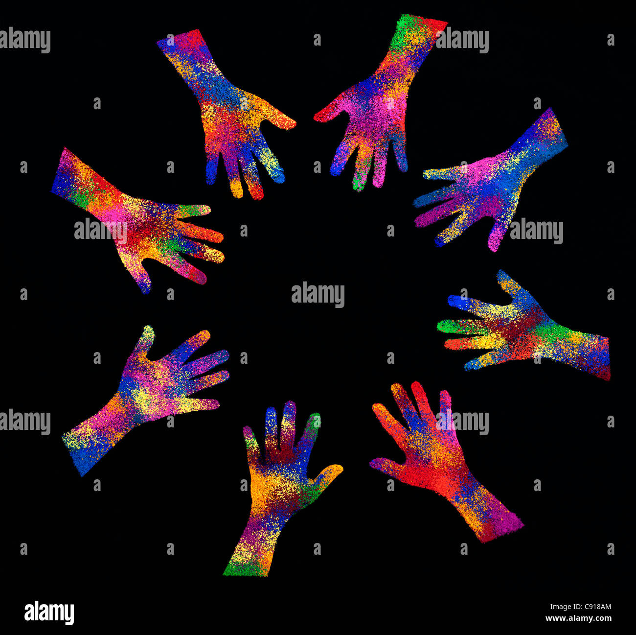 Coloured powder hand prints in a circular pattern on black. India Stock ...
