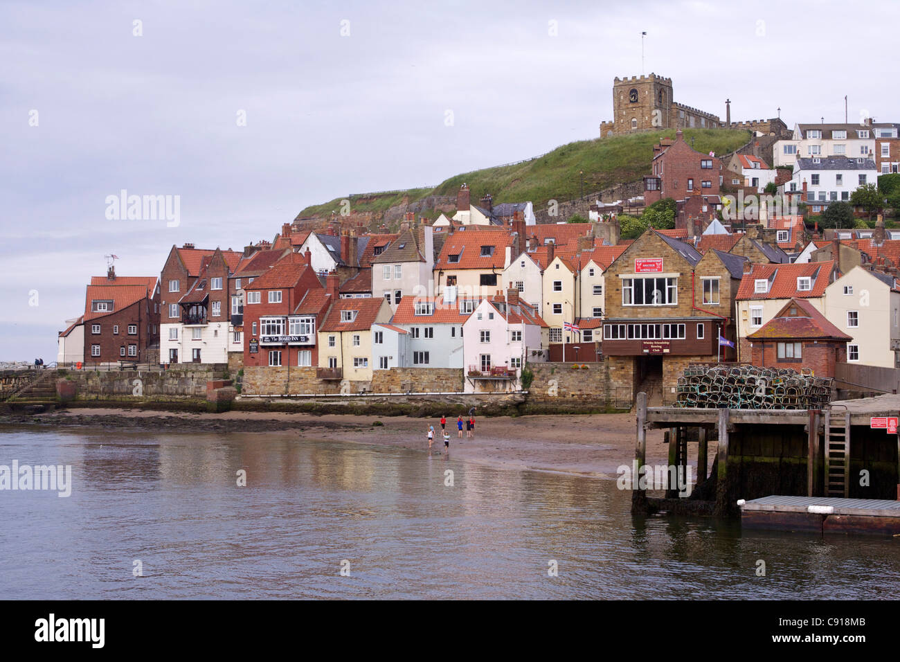 Whitby rowing clubhouse and house of Whitby with St Mary's Church on ...