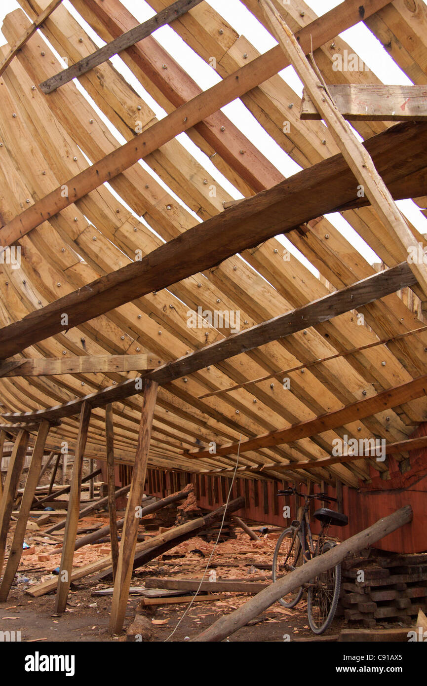 Wooden boat hulls in Skala du Porte boatyard are traditionally built ...