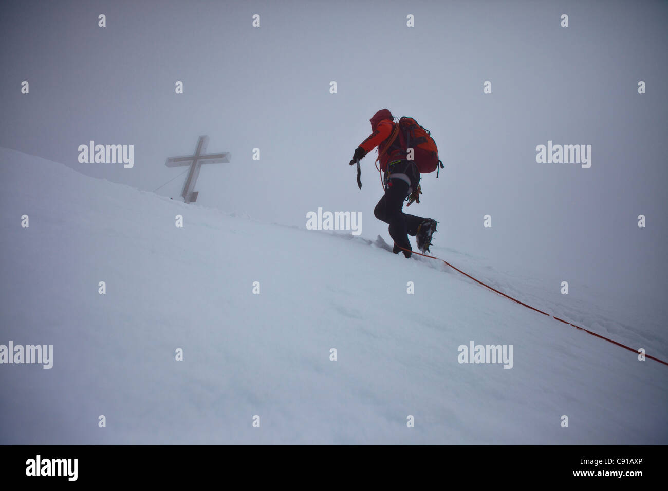 Mountaineer climbing mountain side view hi-res stock photography and ...