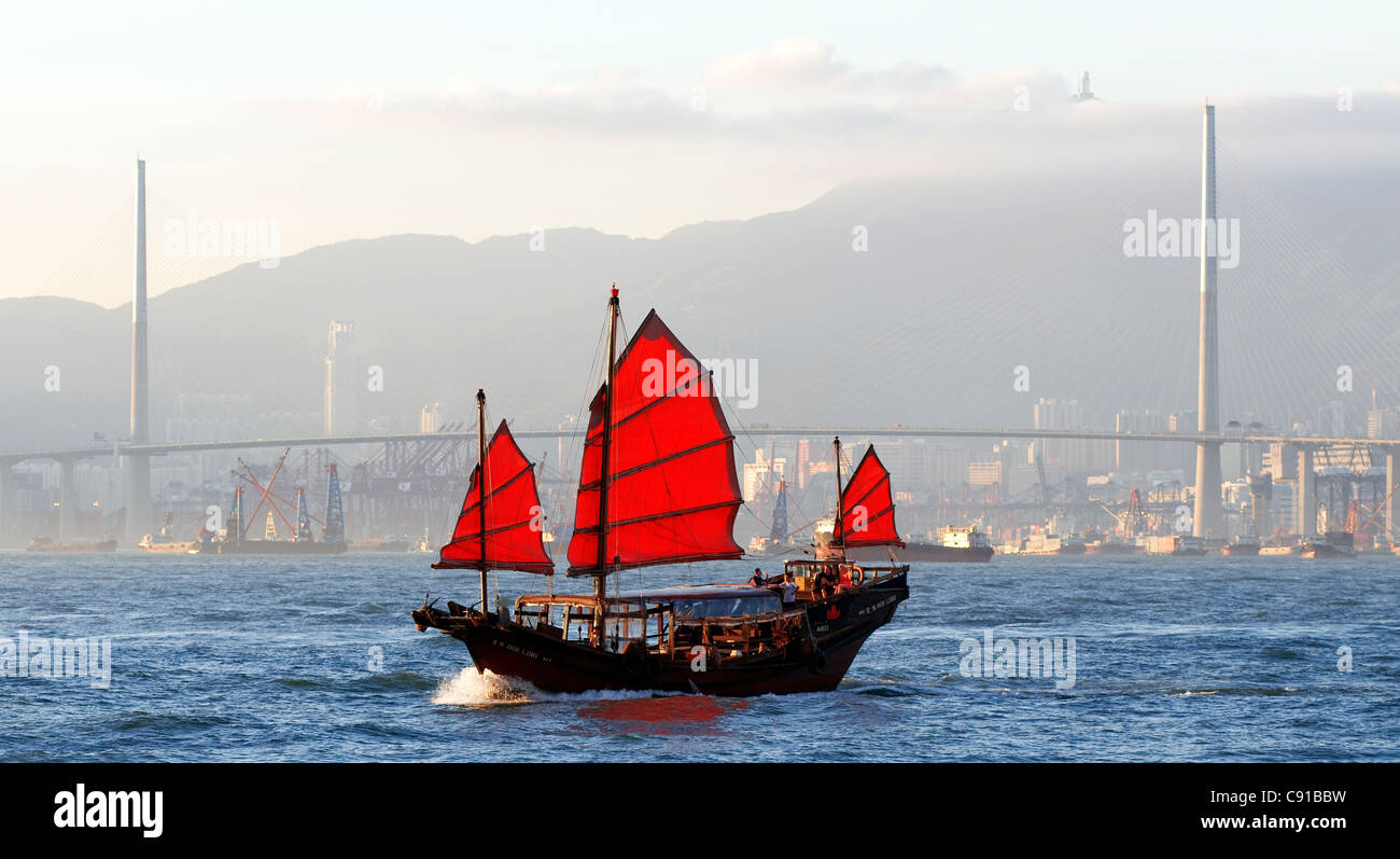 Traditional Chinese junk and the new completed cable-stayed ...
