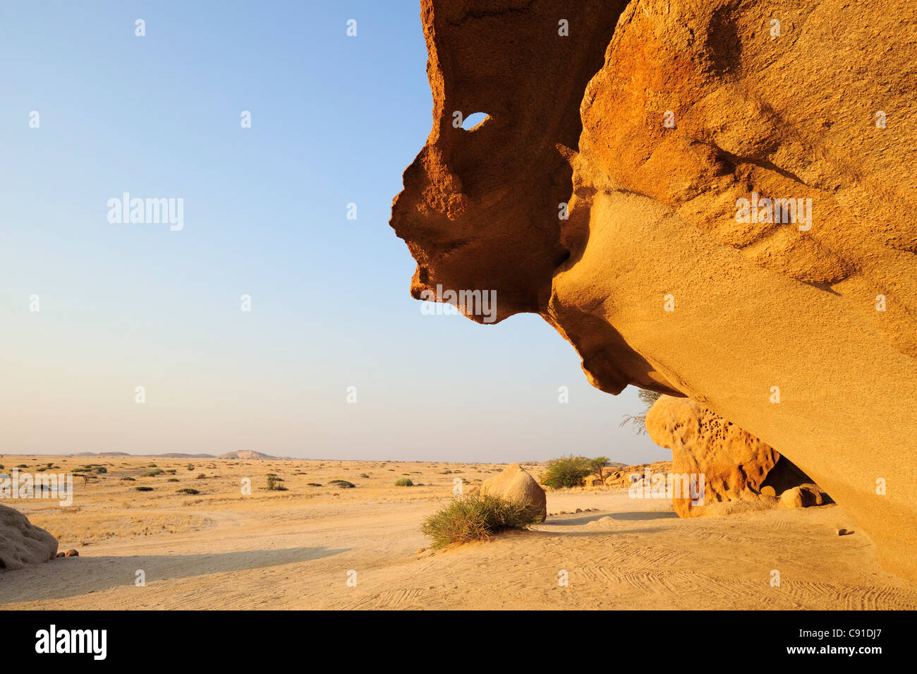 Rock overhang with view to savannah, Namib desert, Namib, Namibia Stock ...
