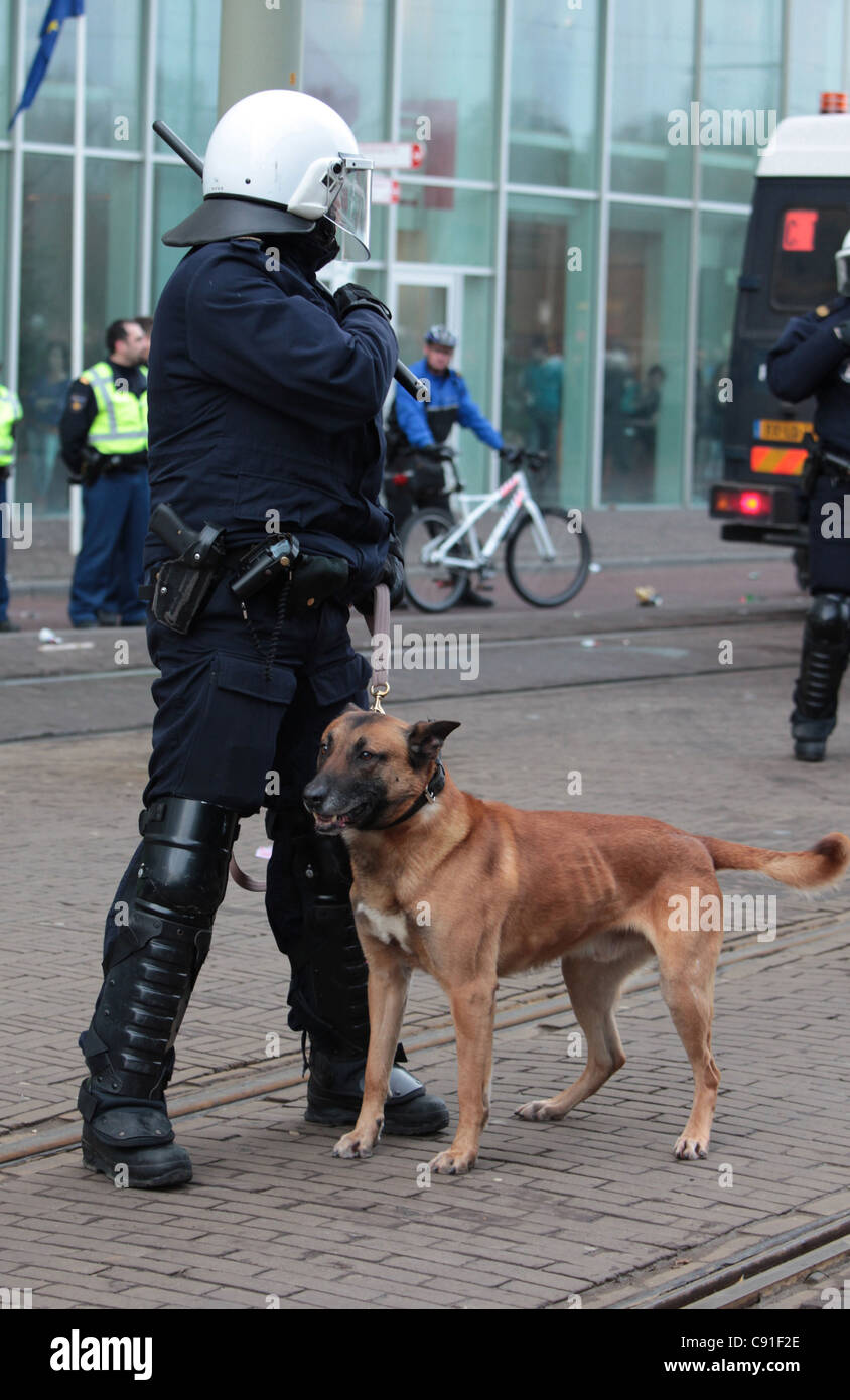 A policeman and a dog Stock Photo - Alamy