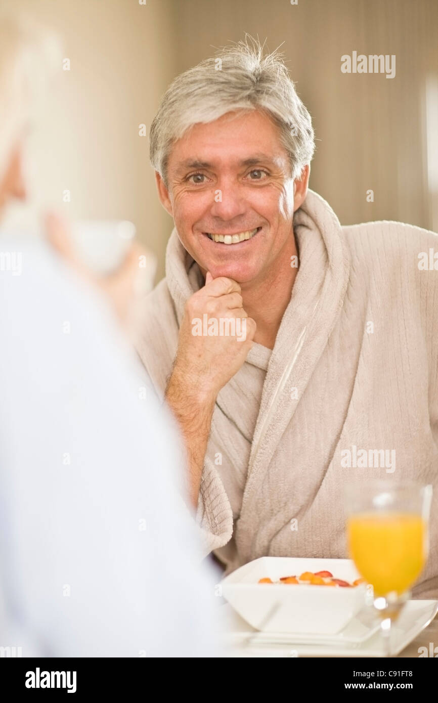 Man having breakfast with wife Stock Photo - Alamy