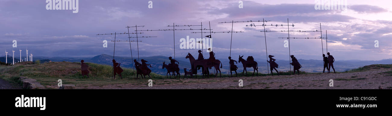 Iron sculptures in barren landscape in the evening Alto del Perdon ...