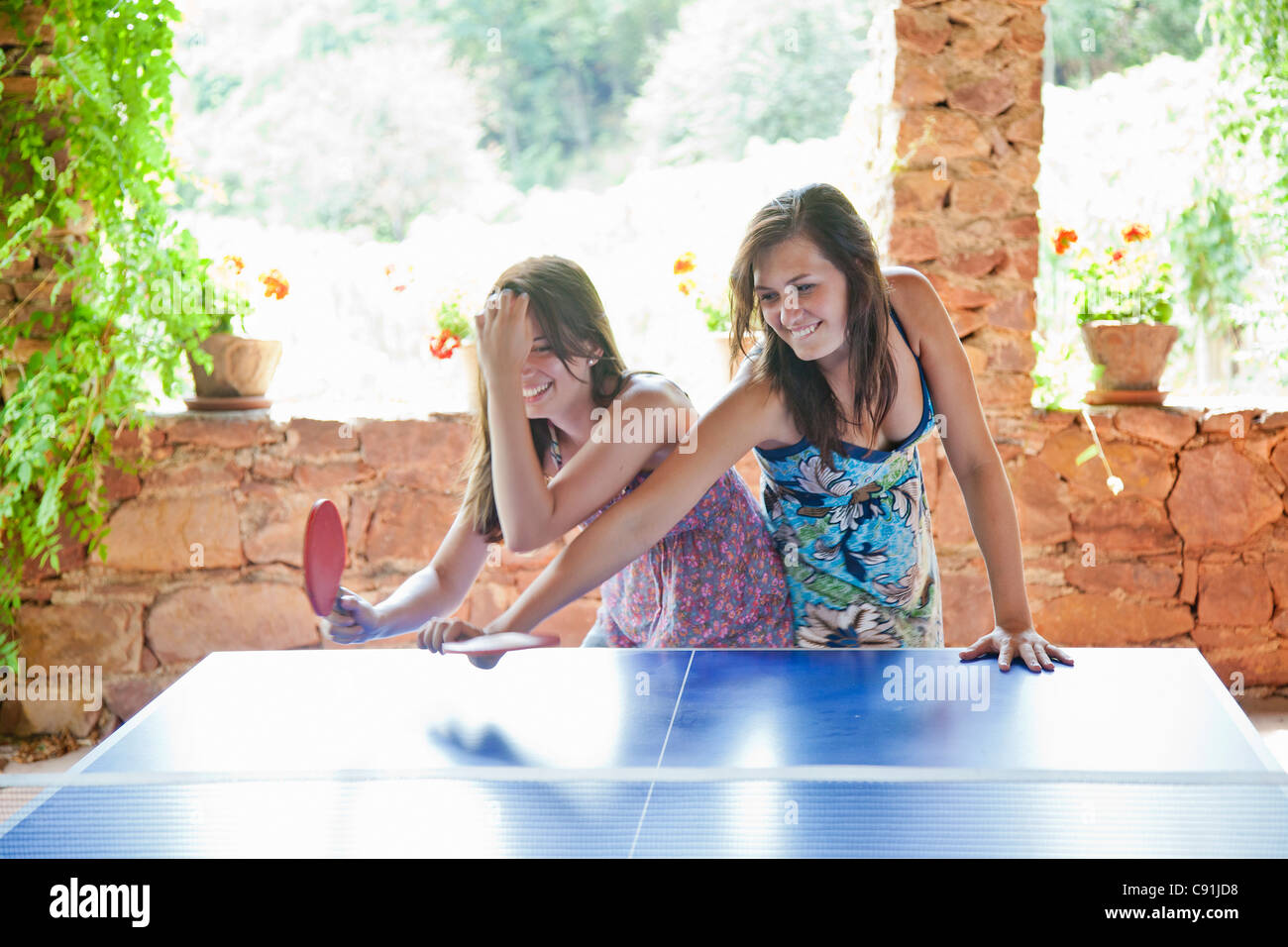Women playing table tennis Stock Photo - Alamy