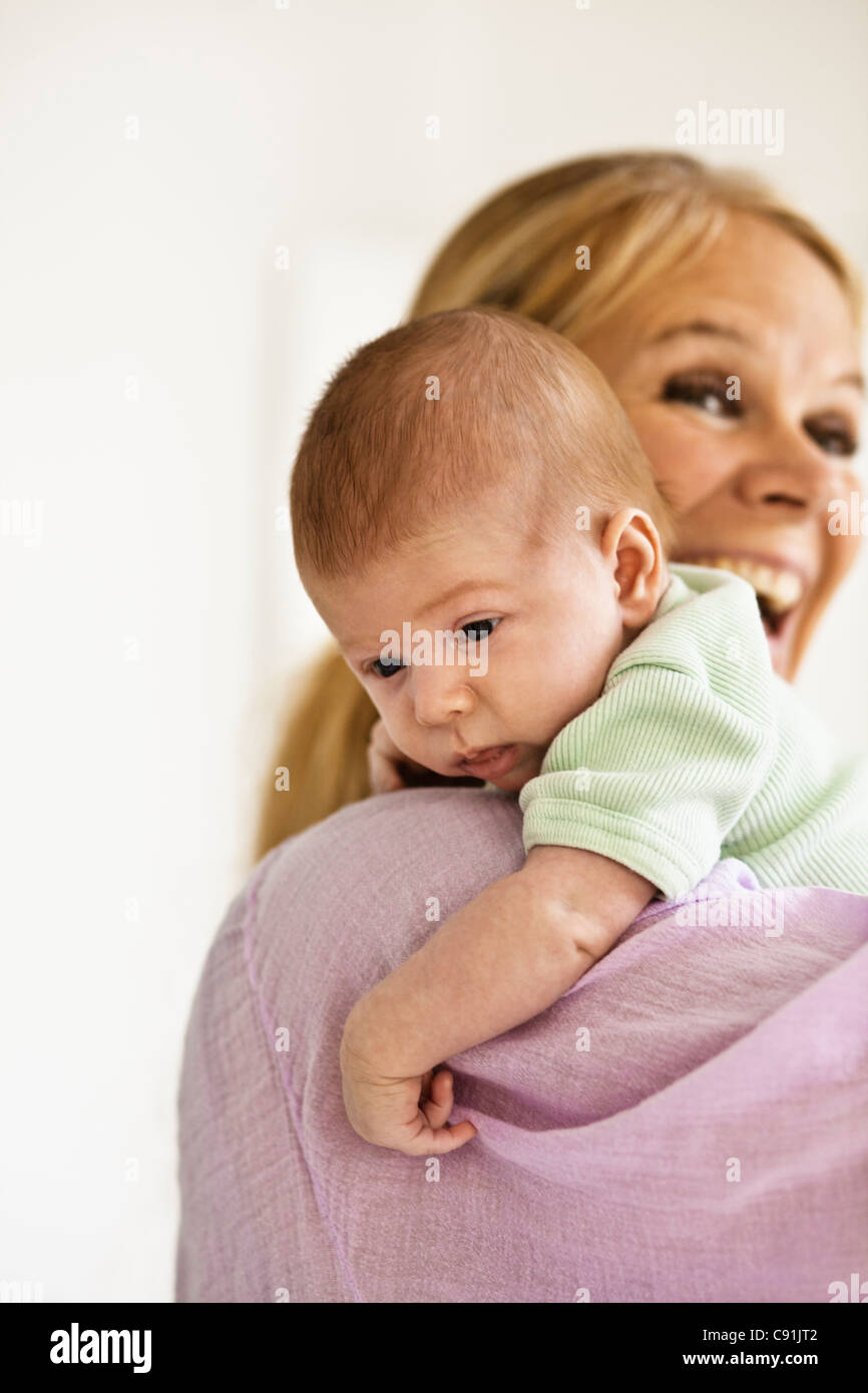 Cradling infant hi-res stock photography and images - Alamy