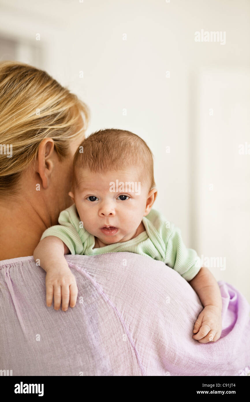 Cradling infant hi-res stock photography and images - Alamy