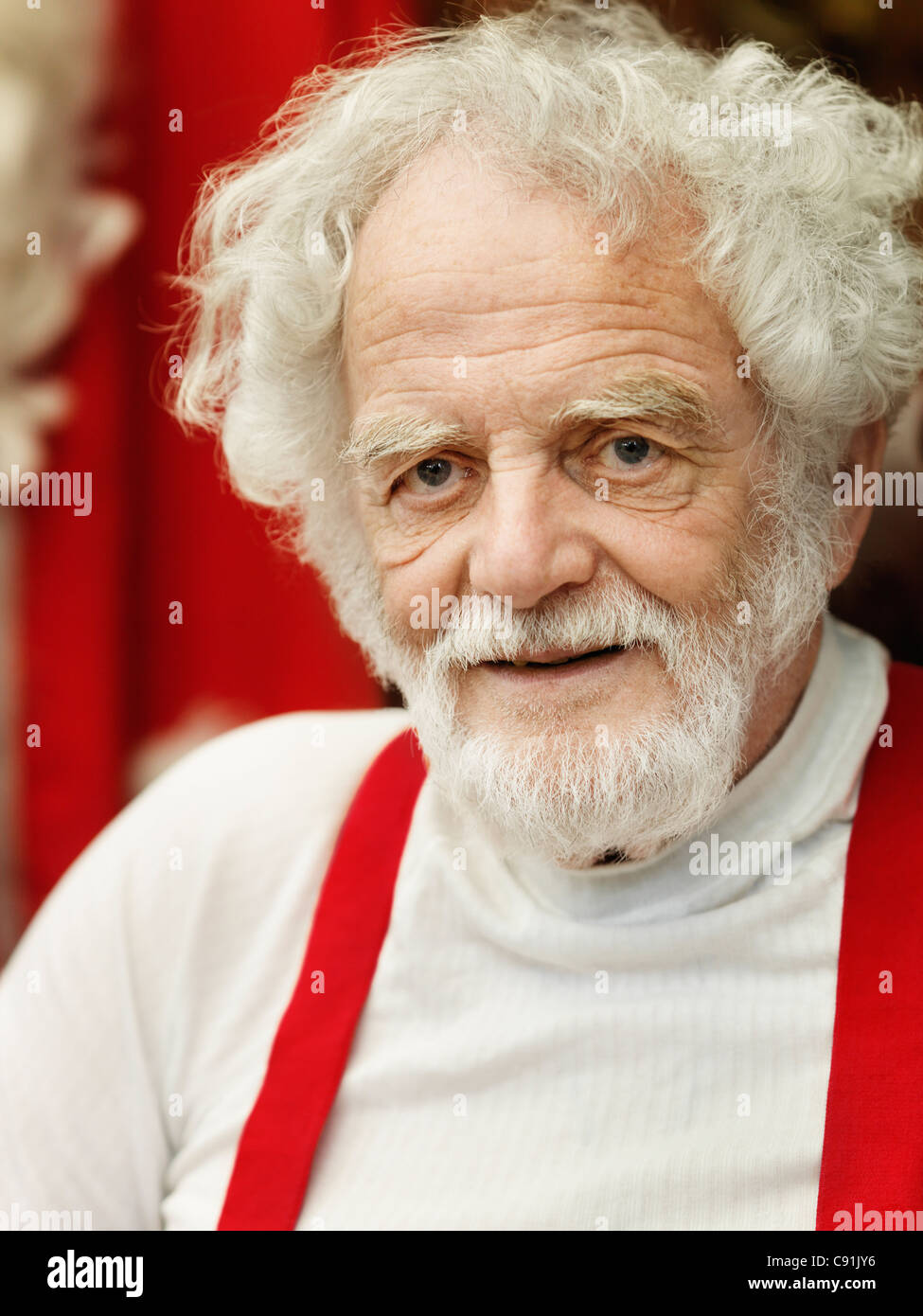 Older man wearing red suspenders Stock Photo - Alamy