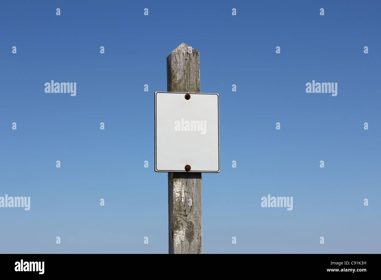White sign on wooden pole hi-res stock photography and images - Alamy