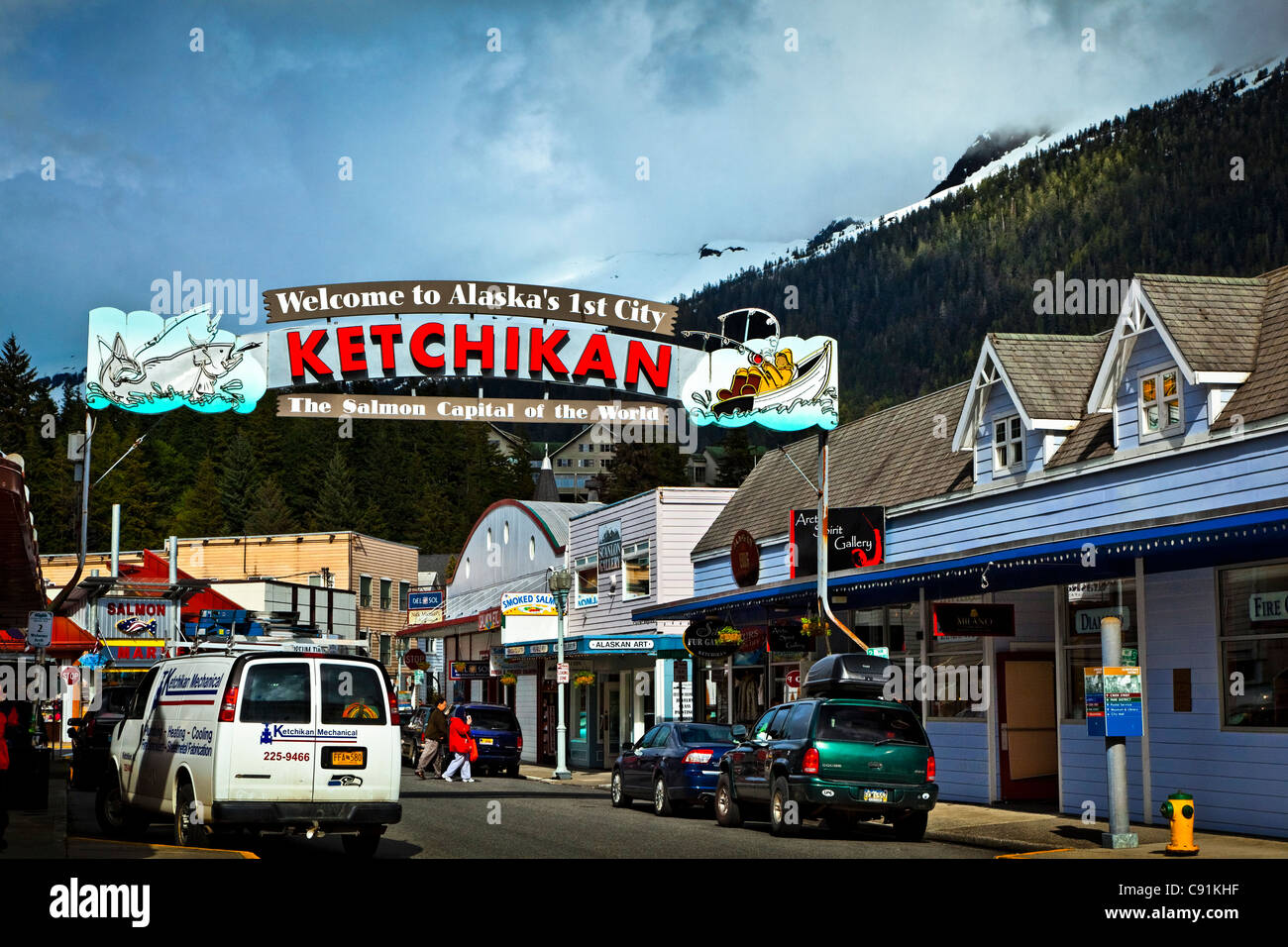 The welcome arch of Ketchikan and colorful giftshops in downtown ...