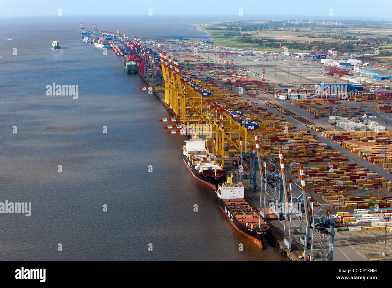 Aerial view of a container port with loading cranes, terminal and ...