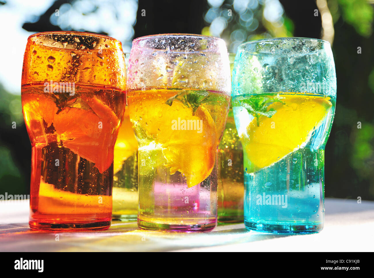 Fruity drinks in colorful glasses Stock Photo - Alamy
