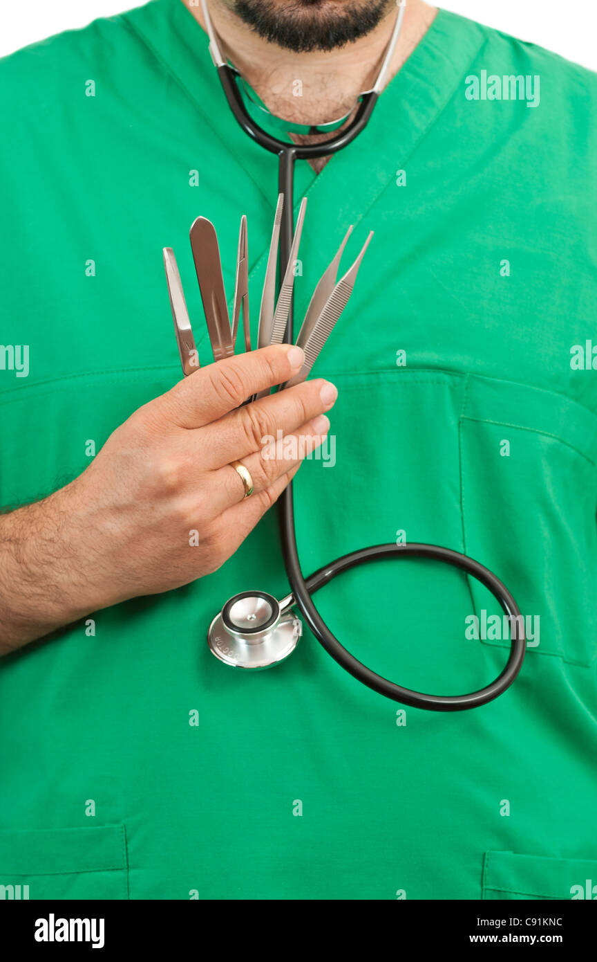 Surgery tools in green surgeon suit Stock Photo - Alamy