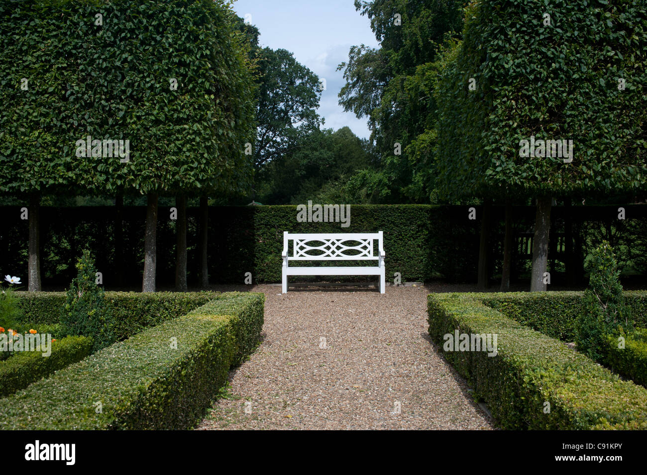 Formal garden design showing symmetrical planting and topiary work ...