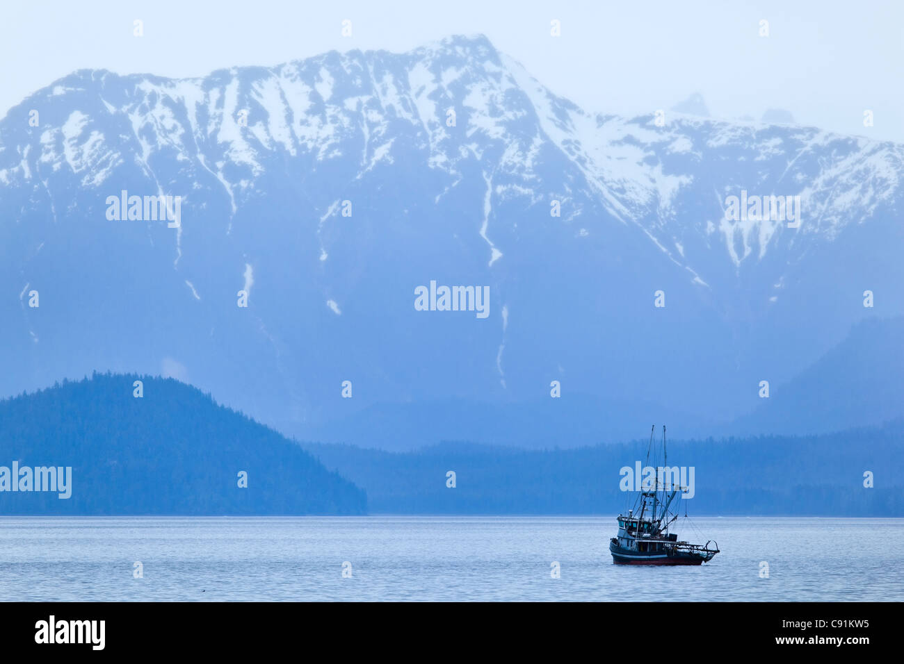 Fishing boat sailing in a misty rain, Frederick Sound, Inside Passage ...