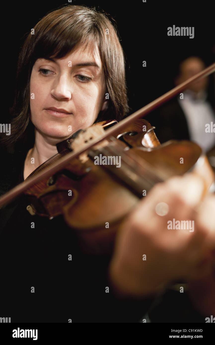 Violin player in orchestra Stock Photo - Alamy