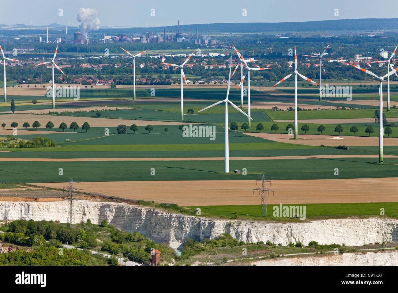 Aerial view of a wind farm turbines in an agricultural landscape lime ...