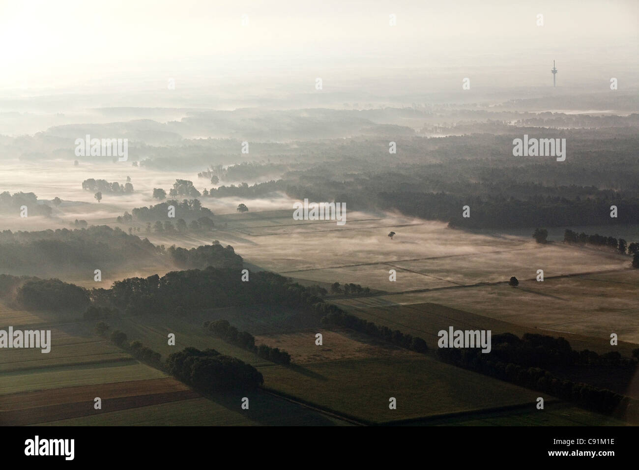 Aerial of flat, North German landscape in the morning mist, Lower ...
