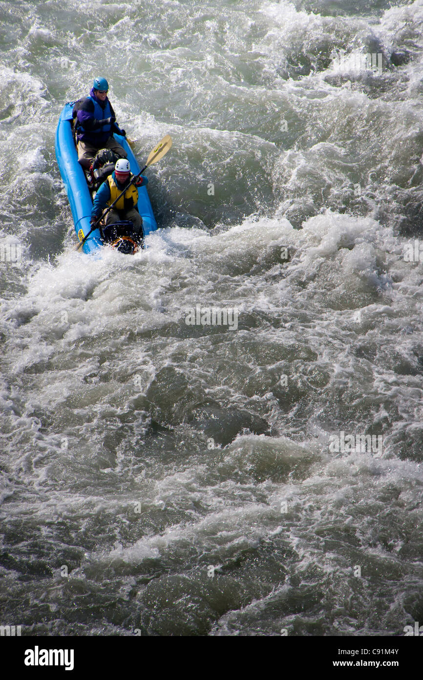 Rafters paddle through whitewater on the Hulahula River rapids in a ...