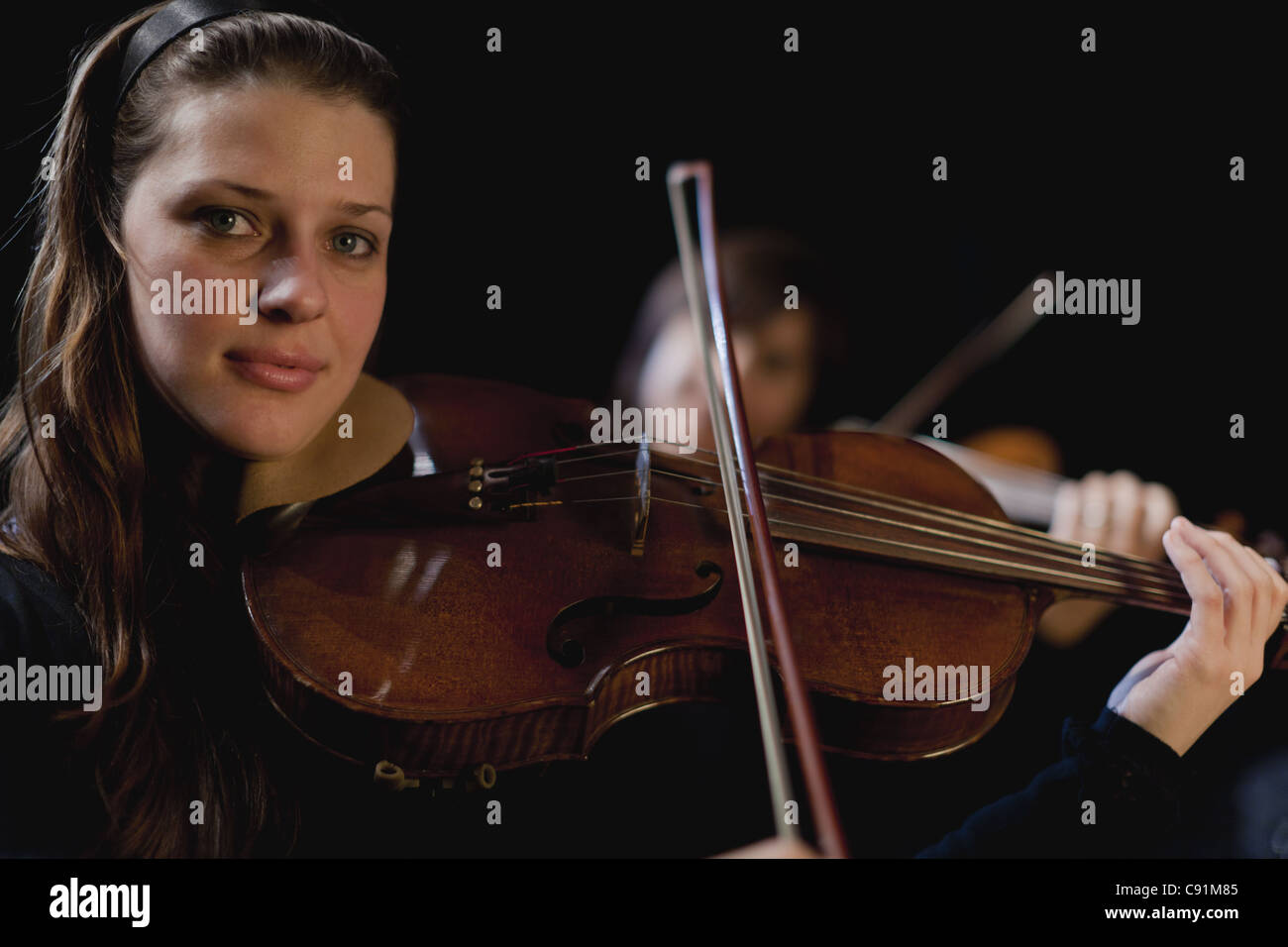 Violin player in orchestra Stock Photo - Alamy
