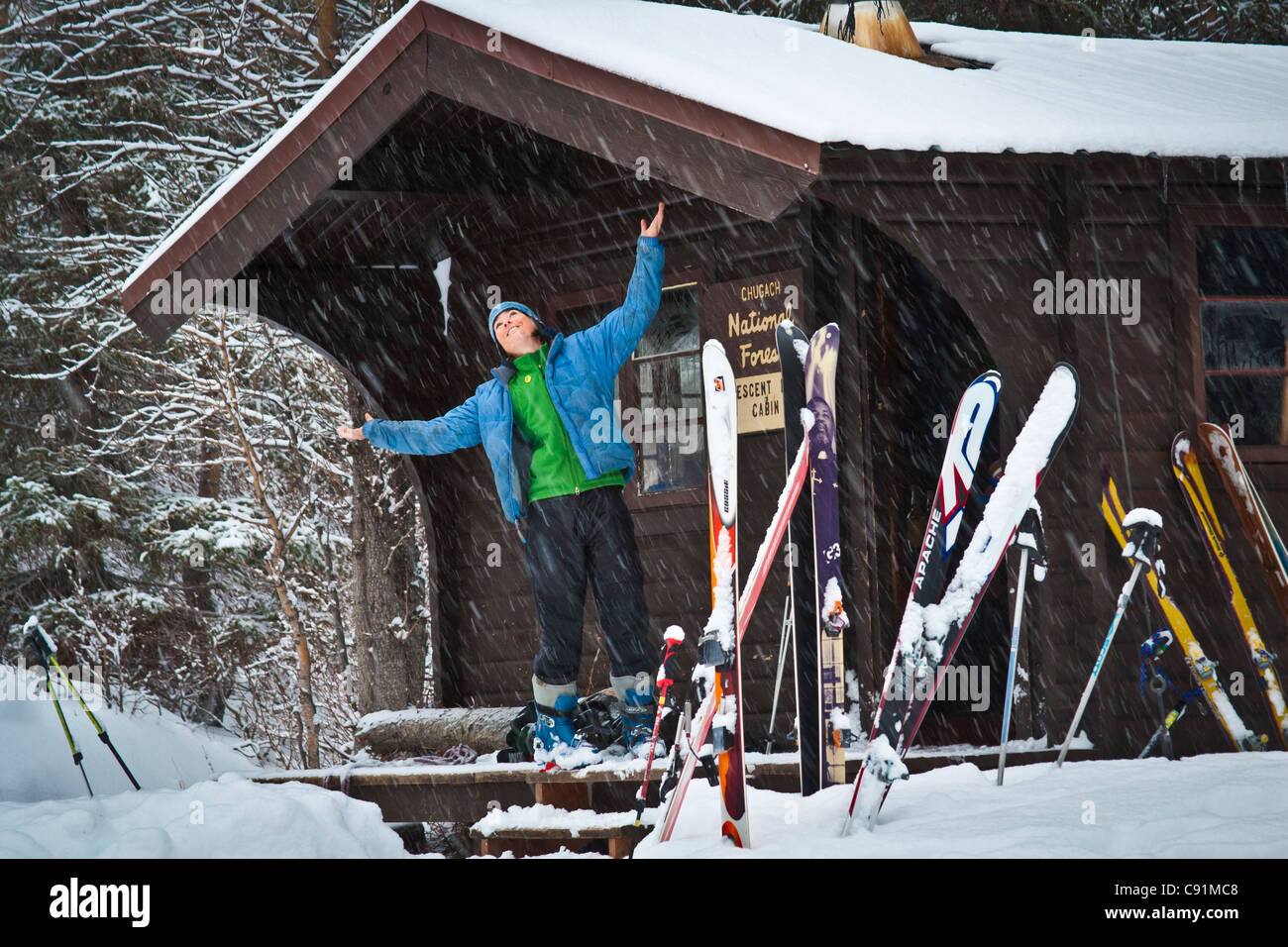 Woman celebrates new snow at the Crescent Lake cabin, Crescent Lake ...