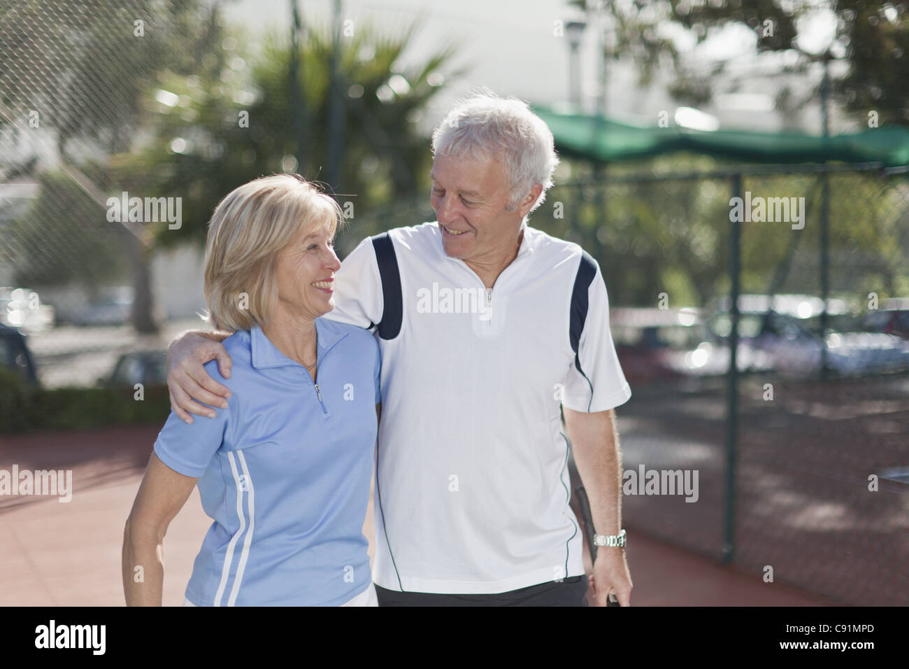 Older couple walking together Stock Photo - Alamy