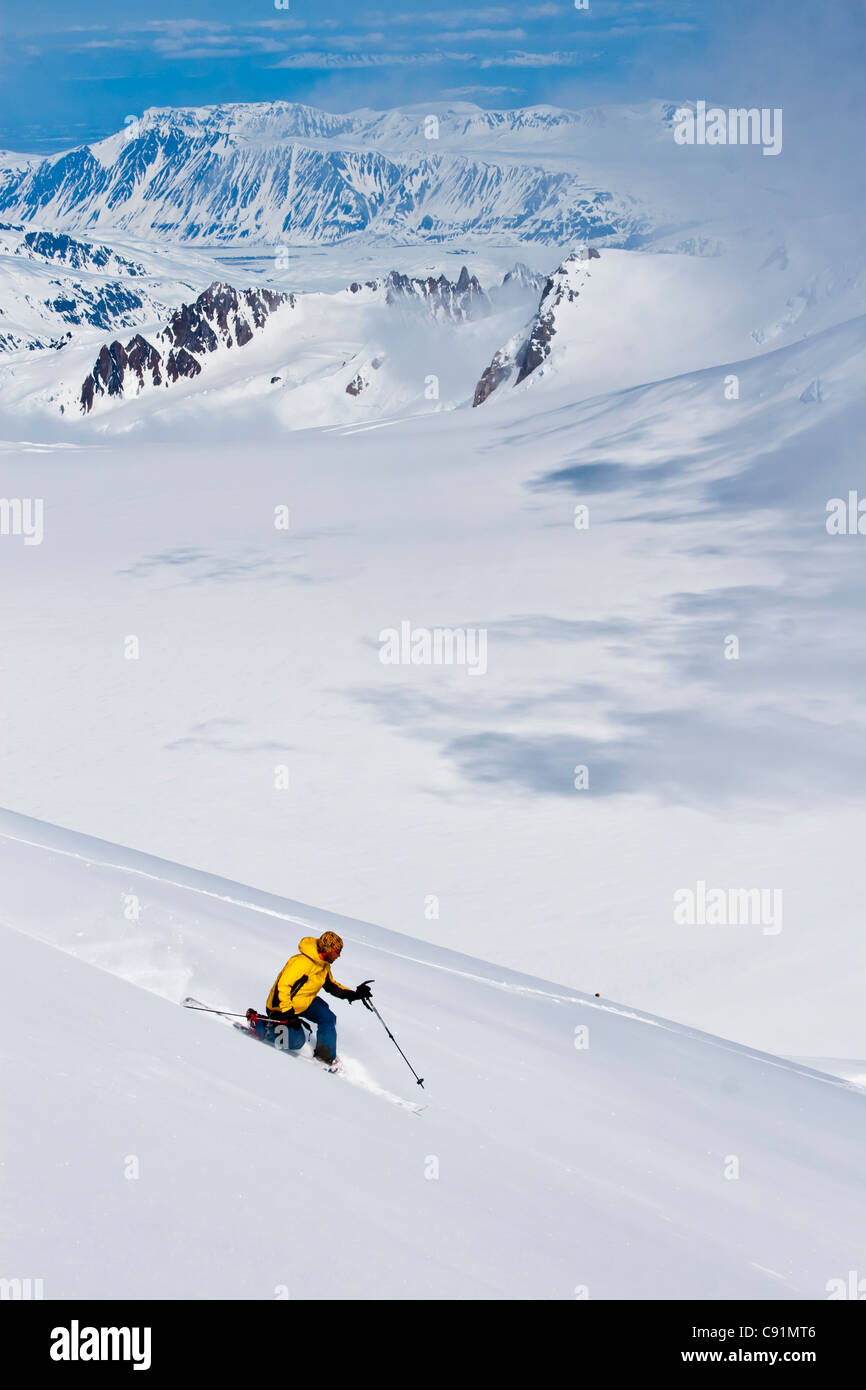Skiers descending from the summit of Mount Gerdine in the Tordrillo ...