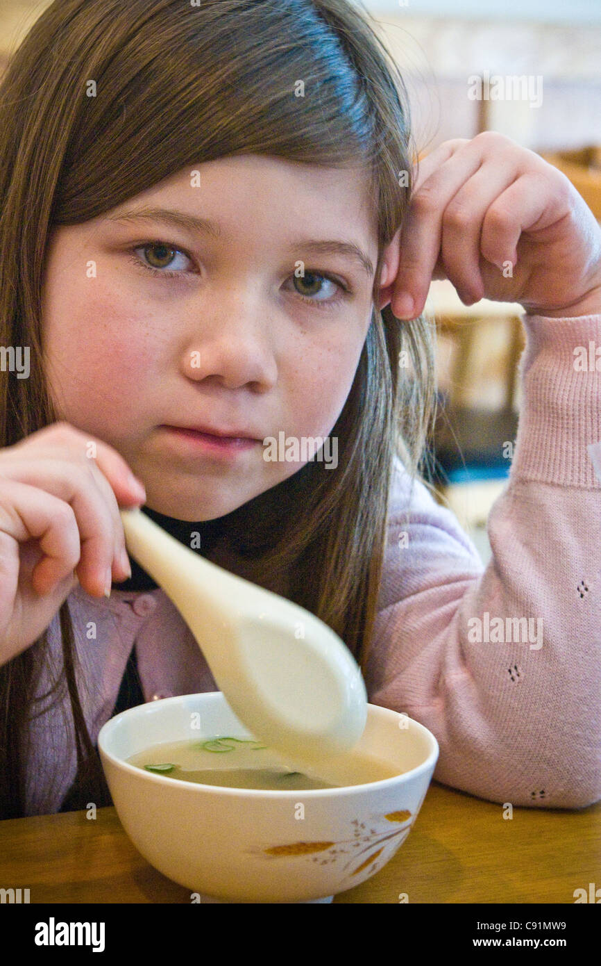 One young girl with bowl of soup Stock Photo - Alamy